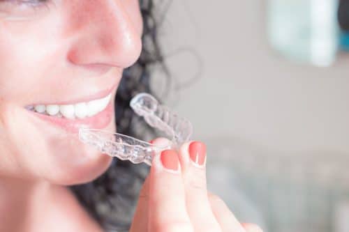 Does Invisalign Hurt? | Suffolk Pediatric Dentistry